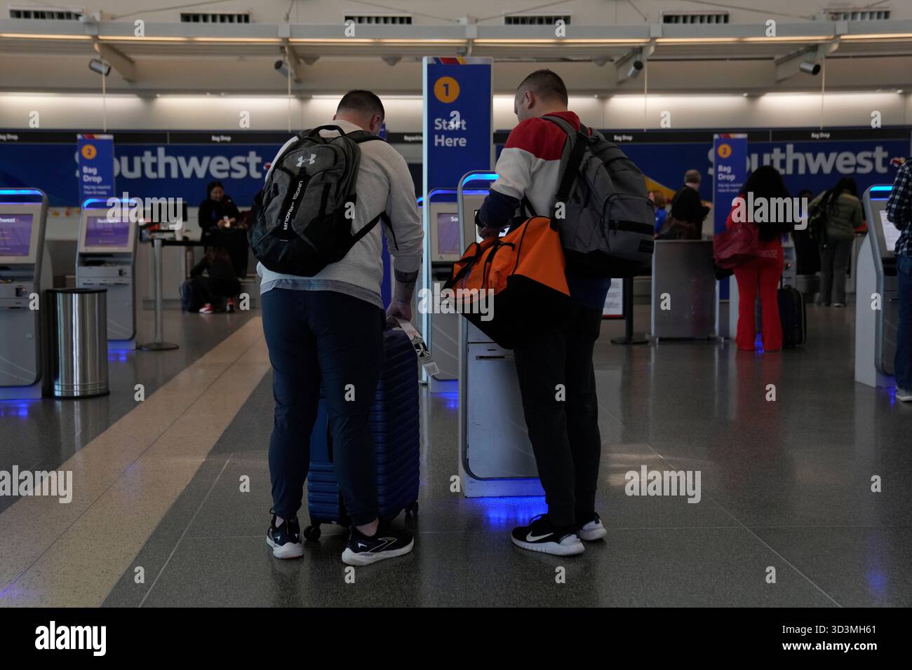 Passengers check in at Midway International Airport, Thursday, Nov. 6 ...