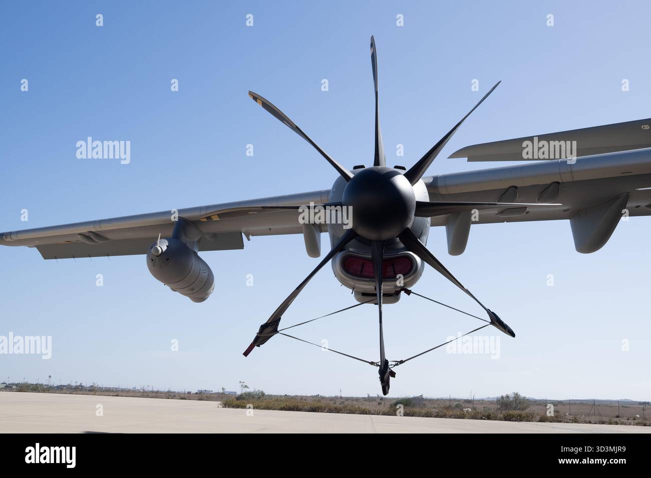 Ground Crew Securing Turboprop Propeller Of Tactical Airlifter Stock