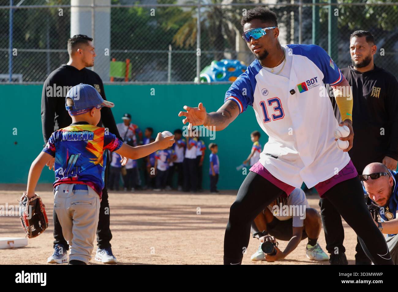 Atlanta Braves' Ronald Acuña Jr. takes part in a baseball clinic for ...