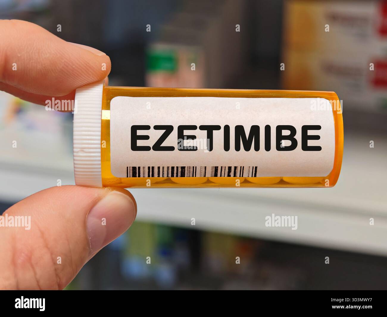 orange plastic Box of EZETIMIBE tablets on a hospital pharmacy table ...