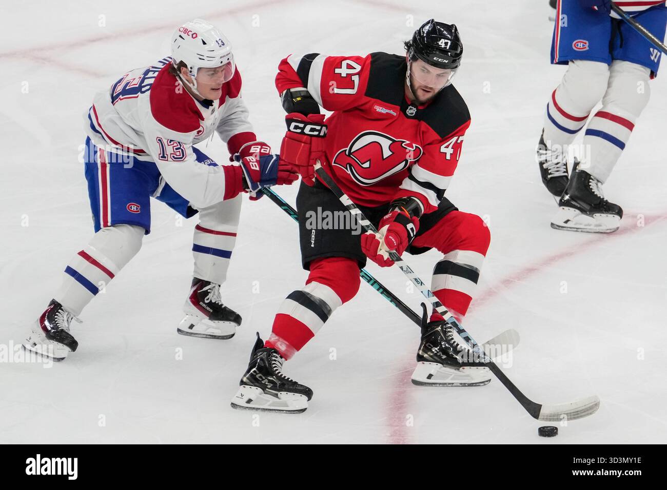 New Jersey Devils left wing Paul Cotter (47) fights for control of the ...
