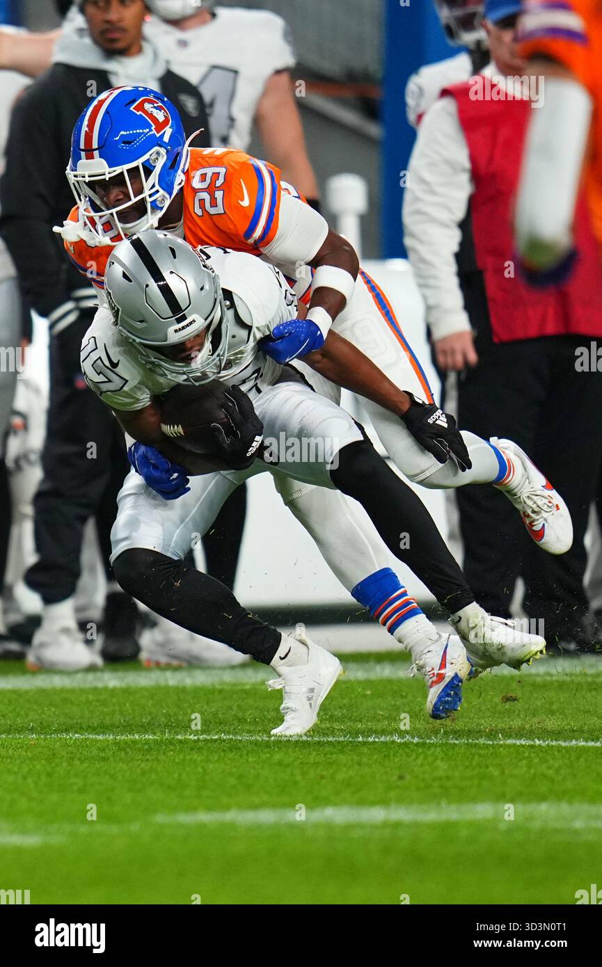 Las Vegas Raiders wide receiver Tyler Lockett (17) is tackled by Denver ...