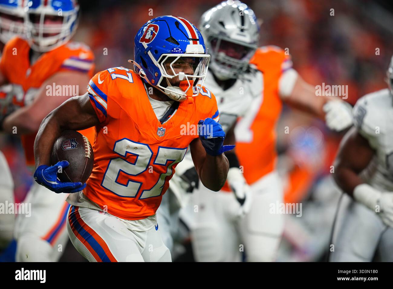 Denver Broncos running back J.K. Dobbins runs with the ball during the ...