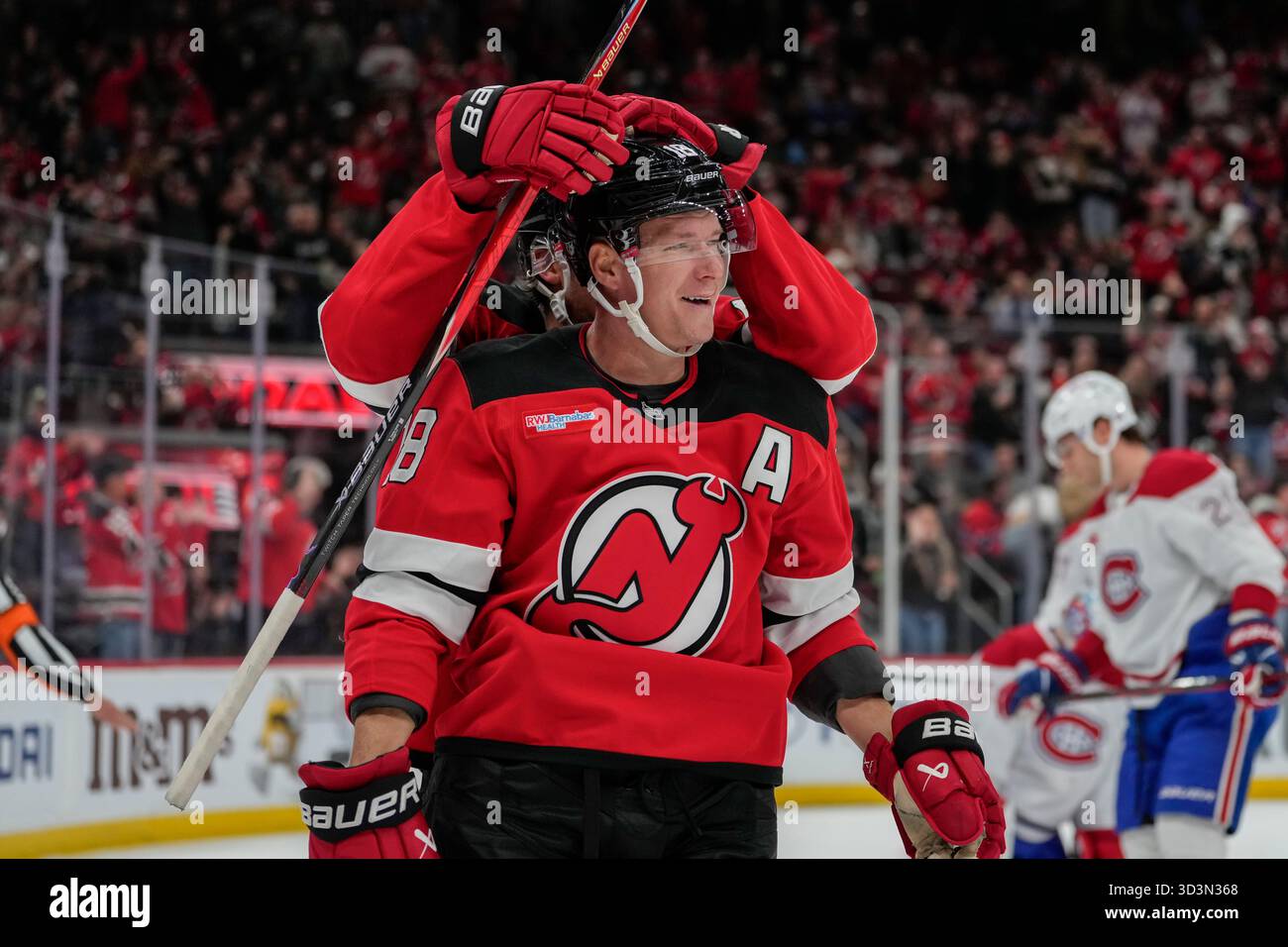 New Jersey Devils left wing Ondrej Palat (18) celebrates with teammates ...