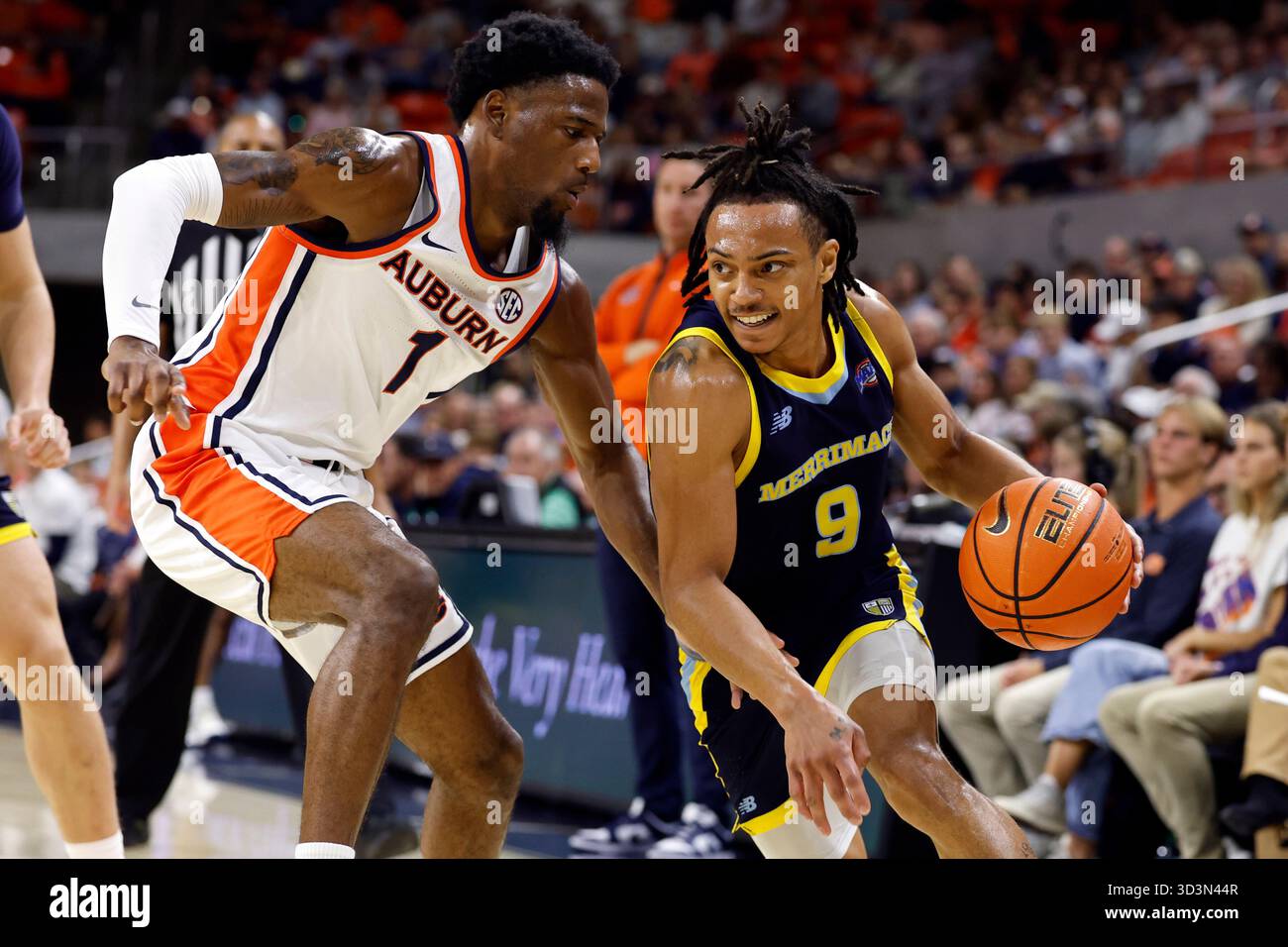 Merrimack guard Malik Edmead (9) drives the baseline around Auburn ...