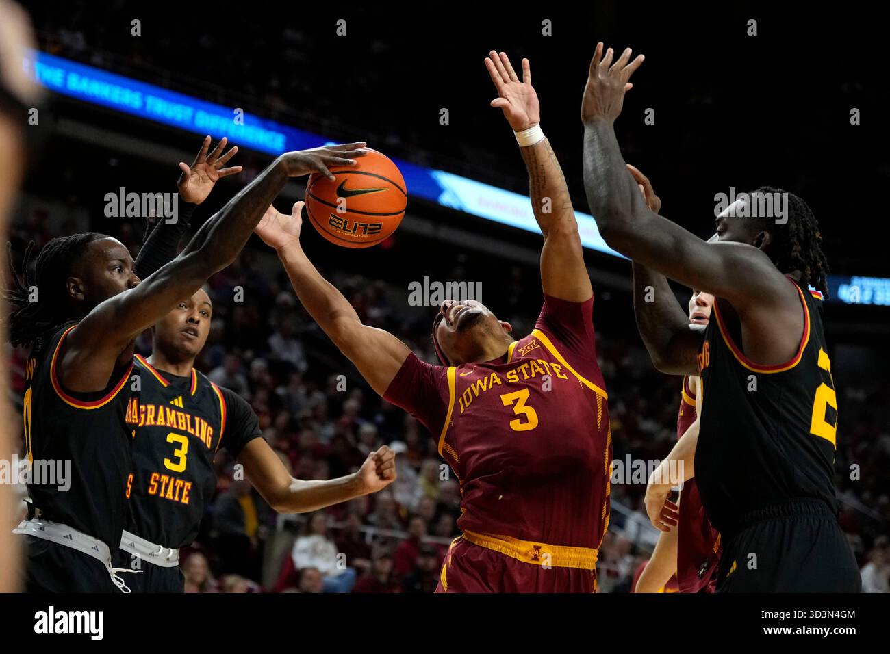 Iowa State guard Tamin Lipsey, center, fights for a rebound with ...