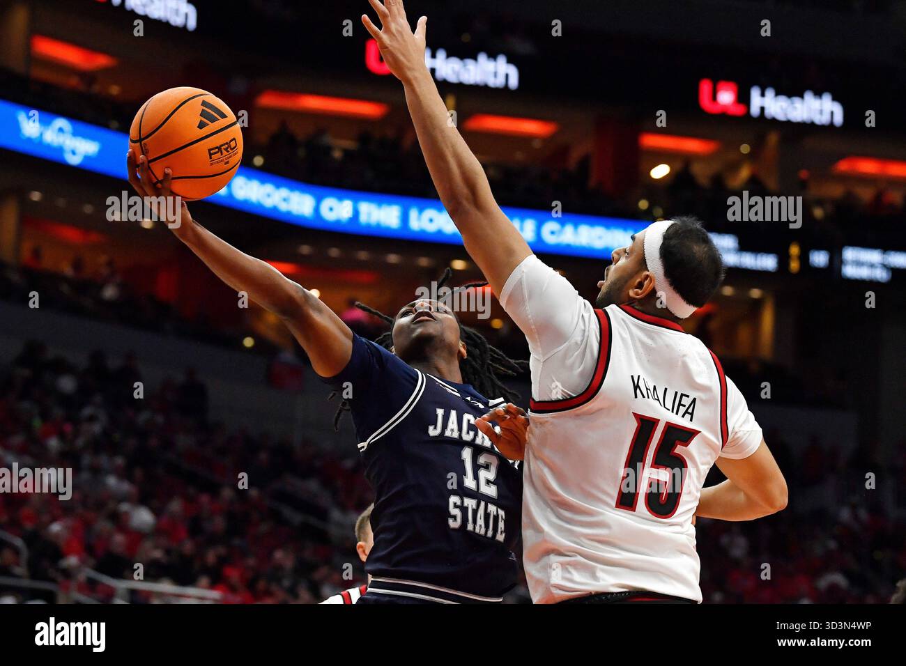 Jackson State guard Delyle Williams (12) attempts a layup past ...