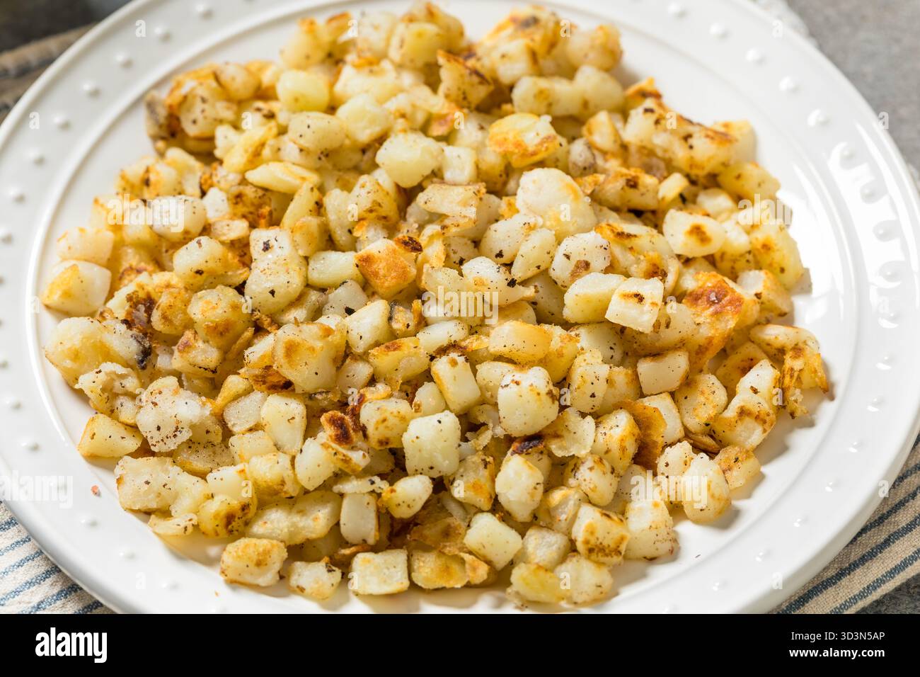 Homemade Cubed Hash Browns Breakfast Potatoes as a Side Stock Photo - Alamy