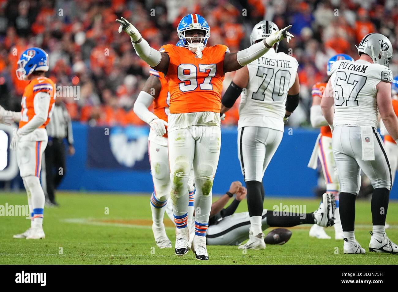 Denver Broncos defensive tackle Malcolm Roach (97) celebrates a sac ...