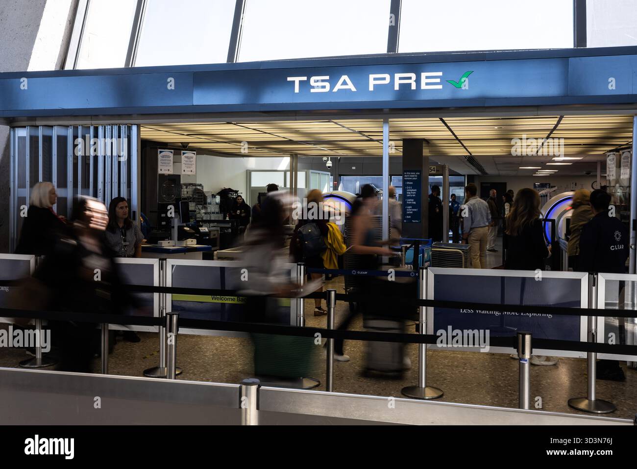 Travelers are seen at a TSA PreCheck security checkpoint at Washington ...