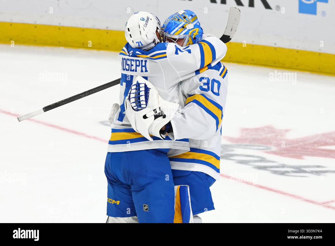 St. Louis Blues right wing Mathieu Joseph (71) and goaltender Joel ...