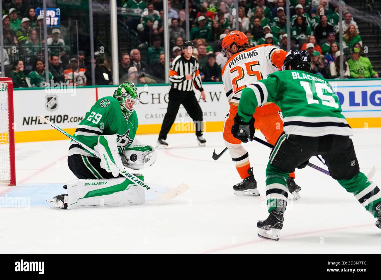 Dallas Stars goaltender Jake Oettinger (29) gloves a shot from Anaheim ...