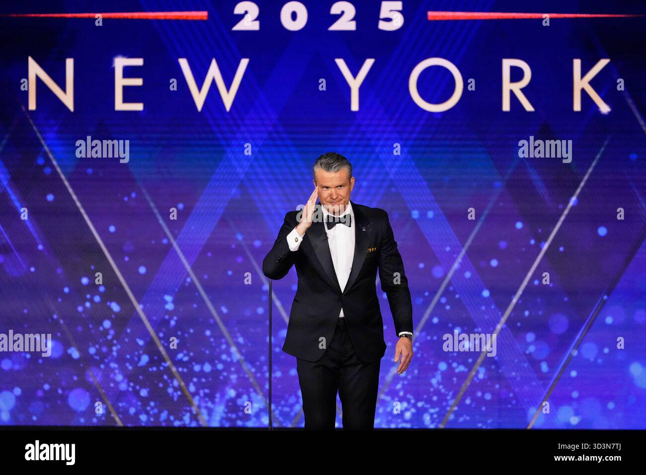 U.S. Secretary of Defense Pete Hegseth salutes the audience after ...