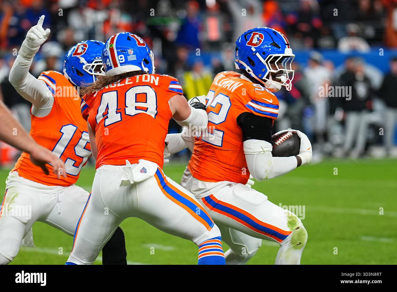 Denver Broncos outside linebacker Dondrea Tillman, right, celebrates ...