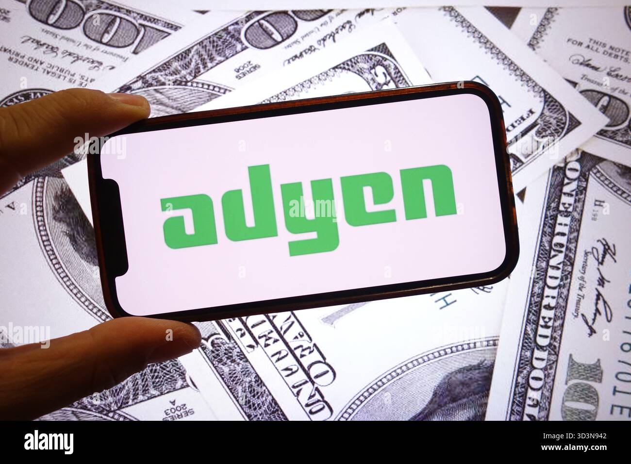 In this photo illustration, the Adyen company logo is seen displayed on ...