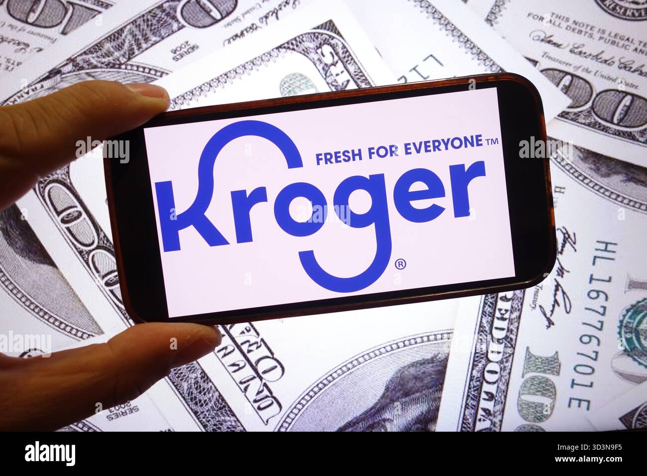 In this photo illustration, the Kroger company logo is seen displayed ...