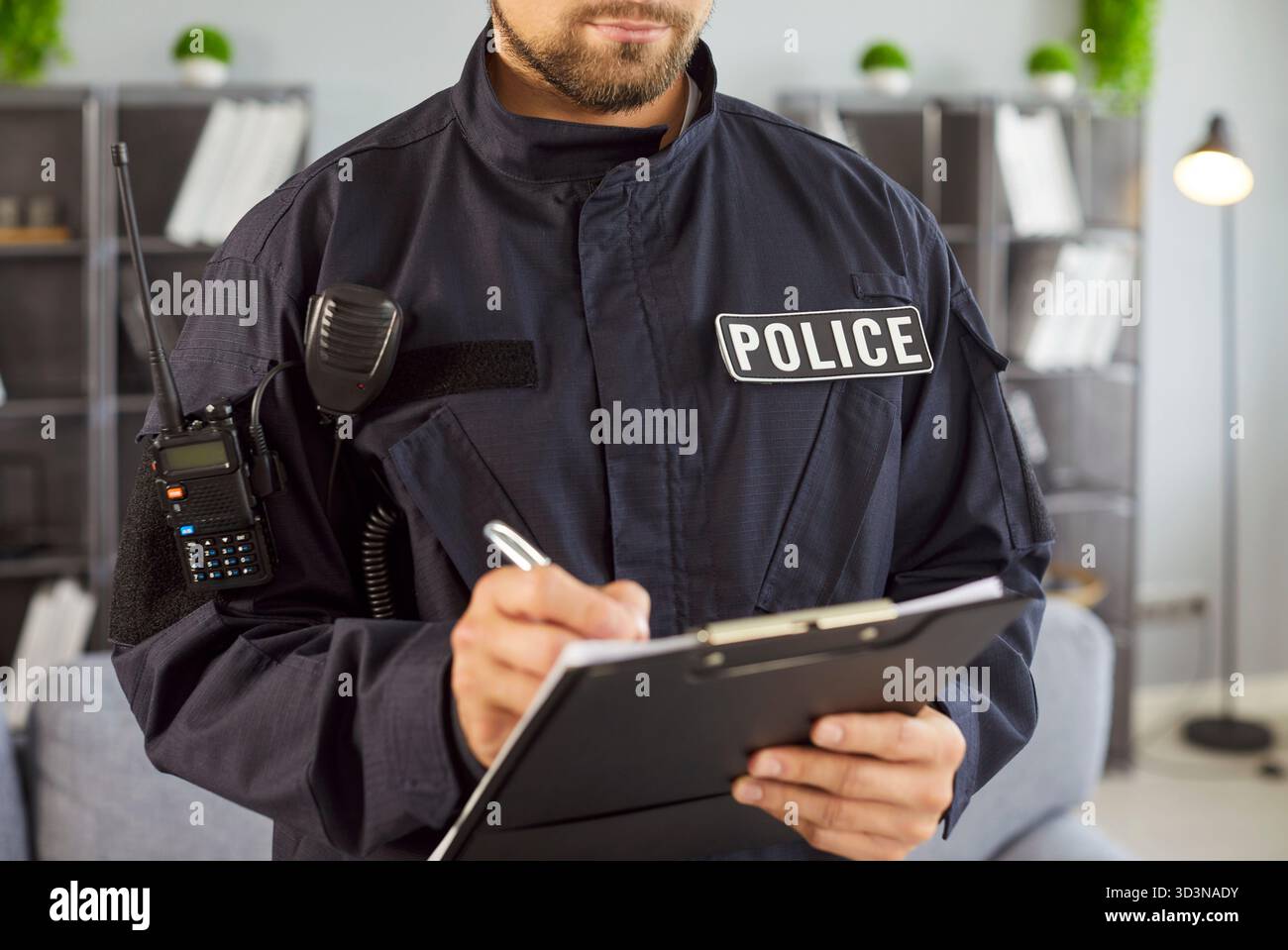 Officer writing up report hi-res stock photography and images - Alamy