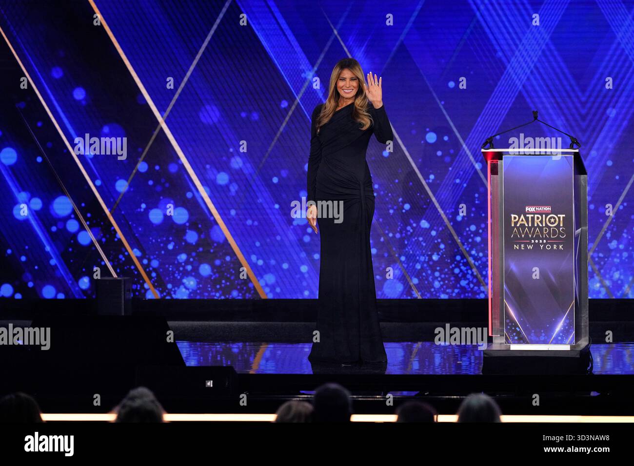 First Lady Melania Trump waves to the audience after speaking at the FOX Nation Patriot Awards ...