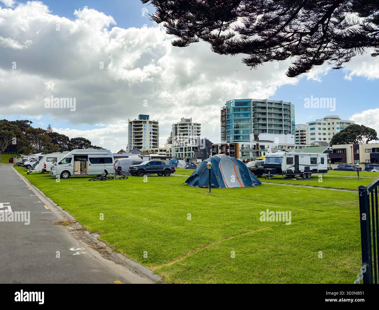 Campground at Mount Maunganui, New Zealand, featuring tents, campervans ...
