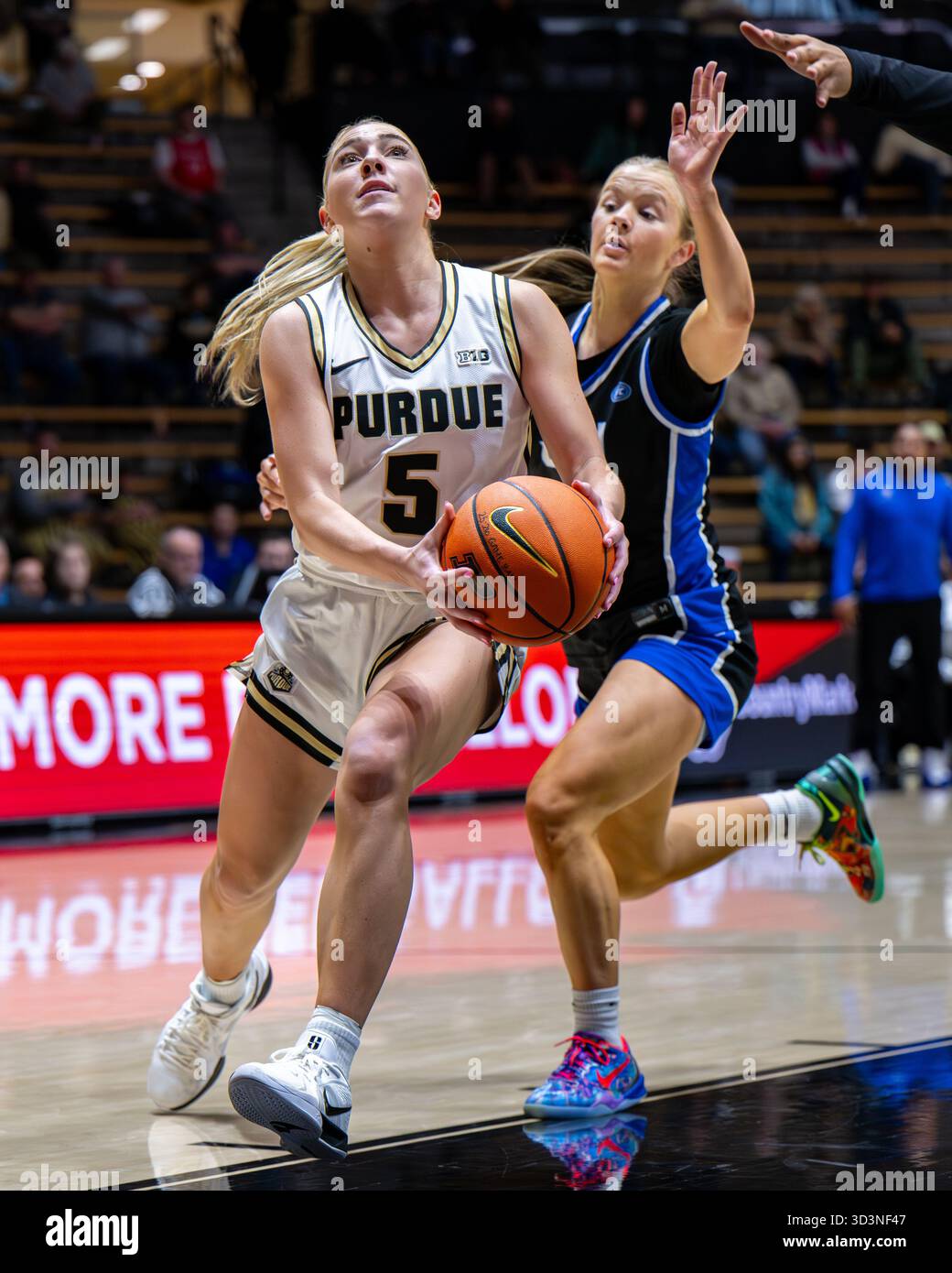Purdue guard Taylor Feldman (5) drives around the defense of Eastern ...