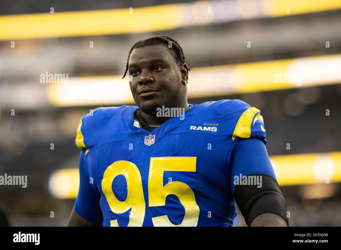 Los Angeles Rams defensive tackle Poona Ford (95) walks back to the ...