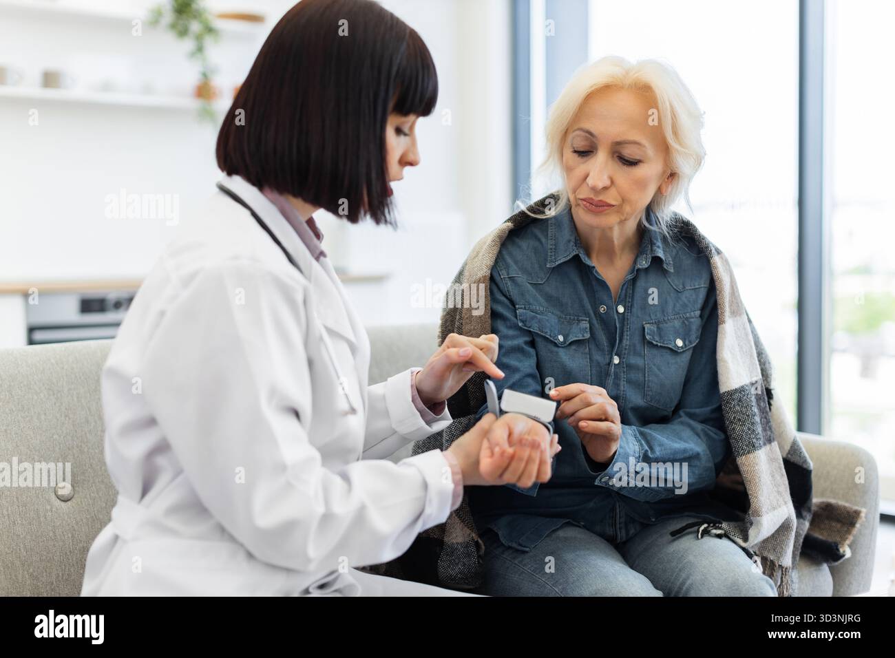 Focused doctor checking patient hi-res stock photography and images - Alamy