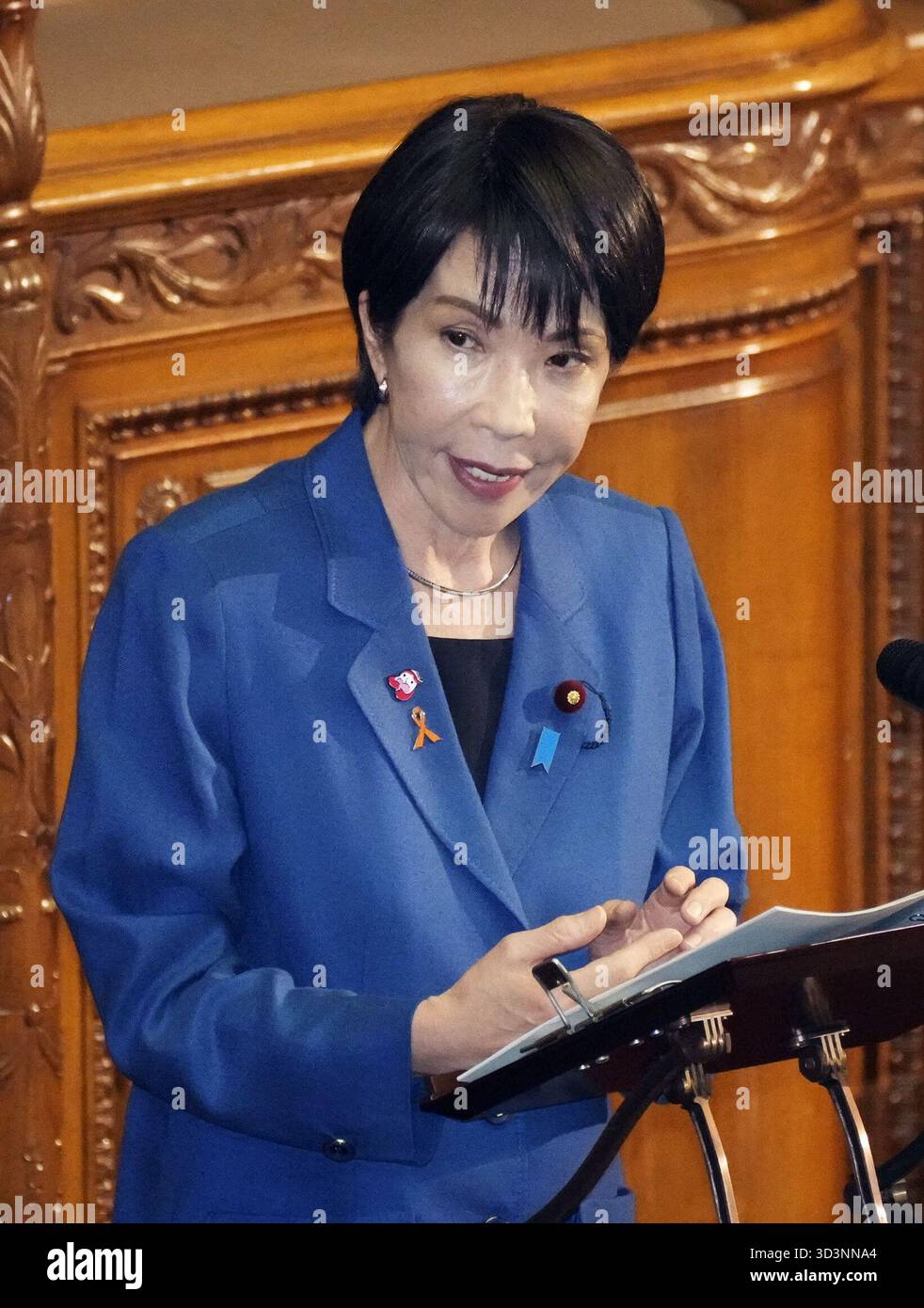 Japanese Prime Minister Sanae Takaichi answers a question during a ...