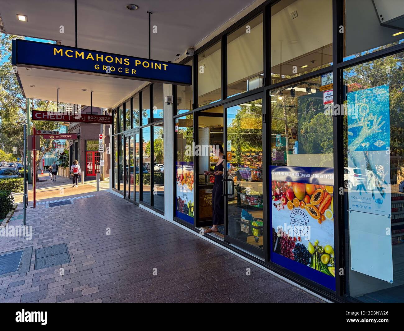 McMahons Point Grocer is a local grocery store with large glass windows ...