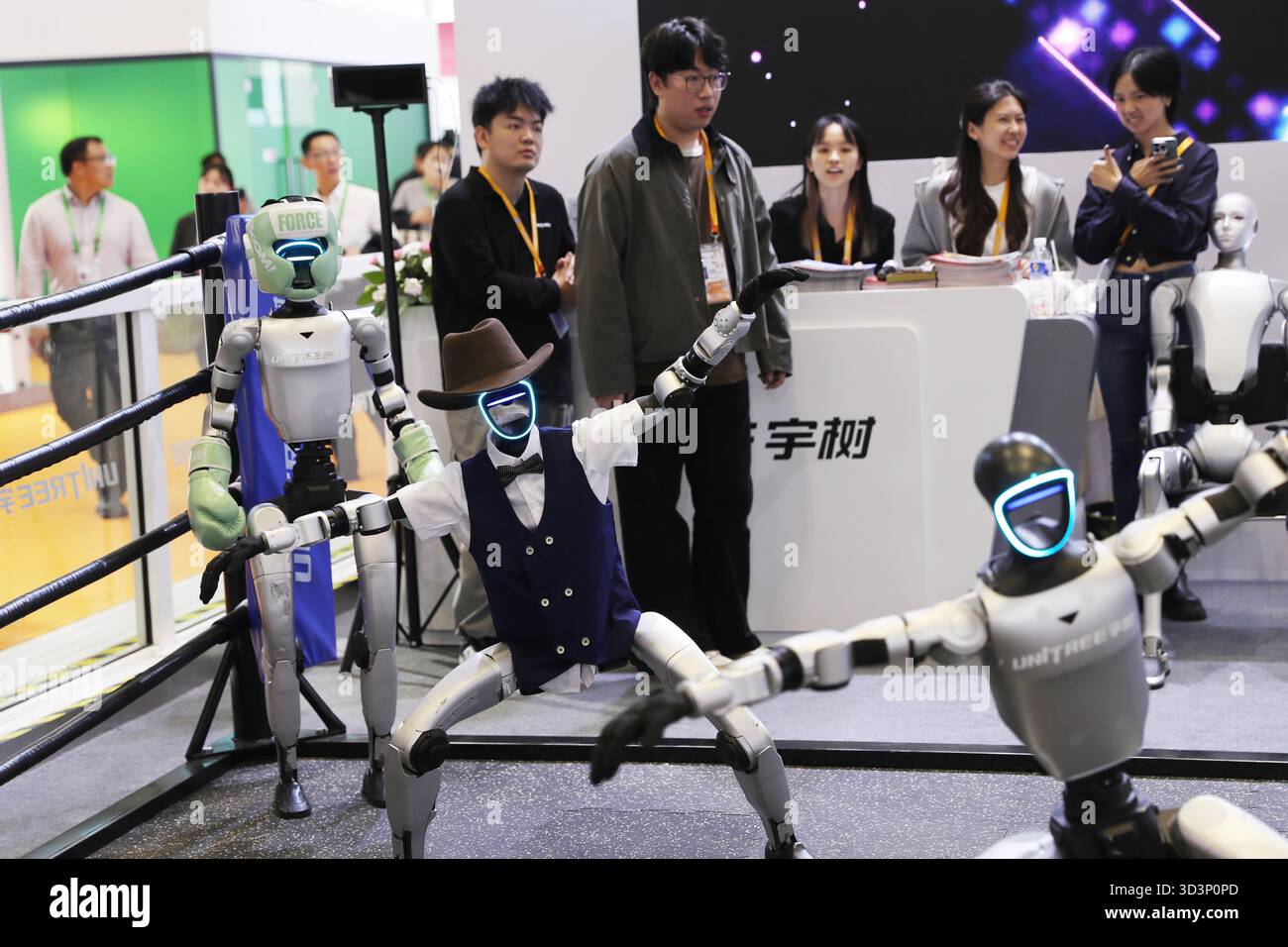 Visitors watch a robot boxing game at the 8th China International ...