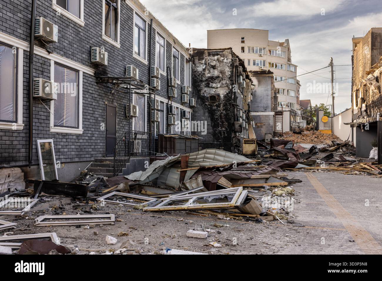 Aerial view of urban destruction partially intact buildings with AC ...