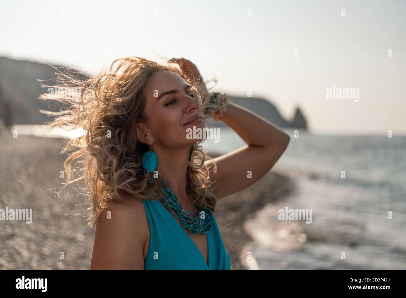 Beautiful woman gently blowing hi-res stock photography and images - Alamy