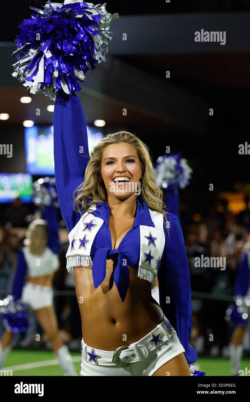 A Dallas Cowboys cheerleader performs before a NFL football game ...