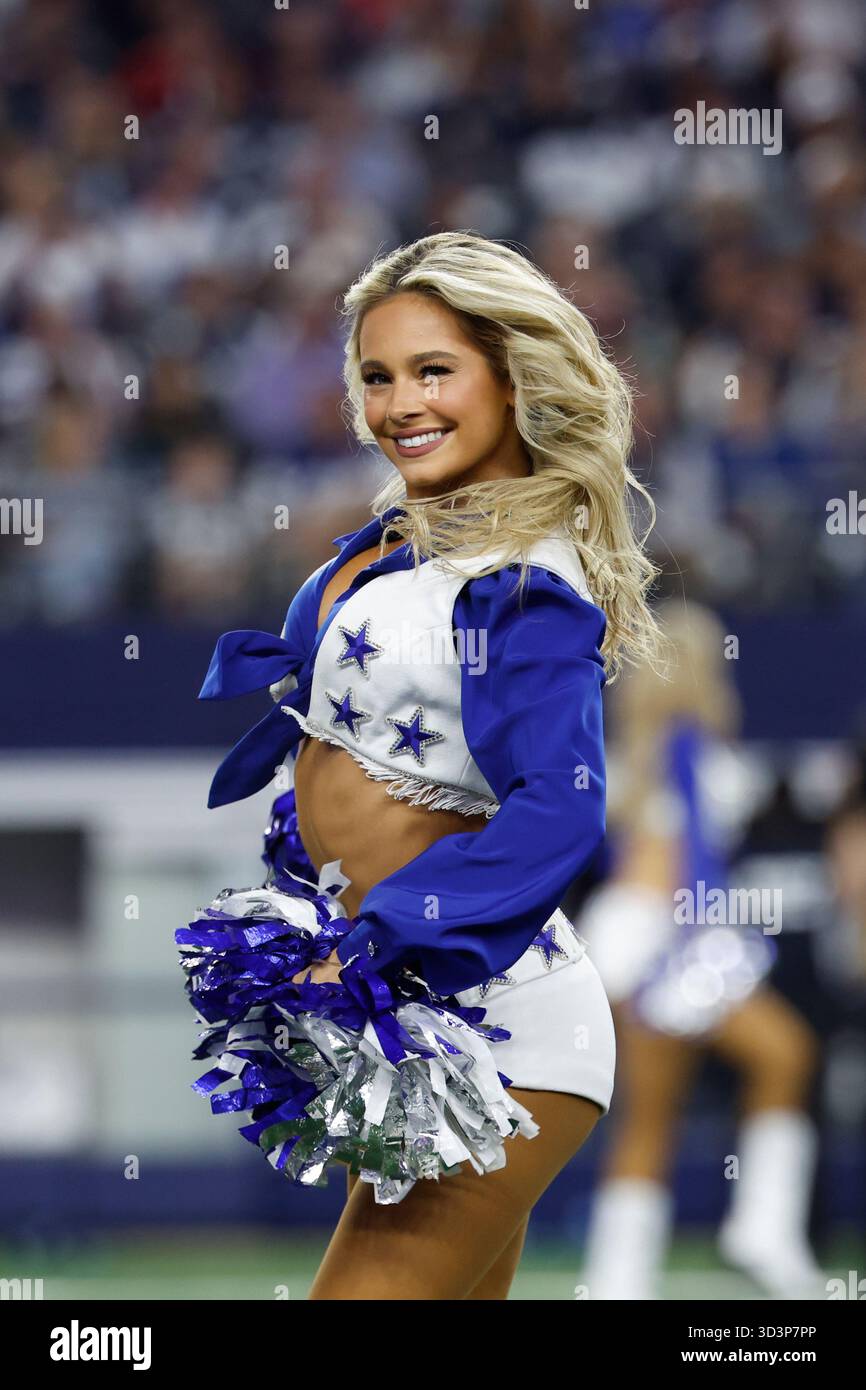 A Dallas Cowboys cheerleader performs during a NFL football game ...