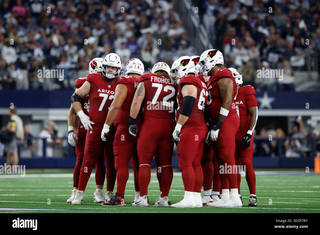 Arizona Cardinals offensive group huddle together for a play call ...