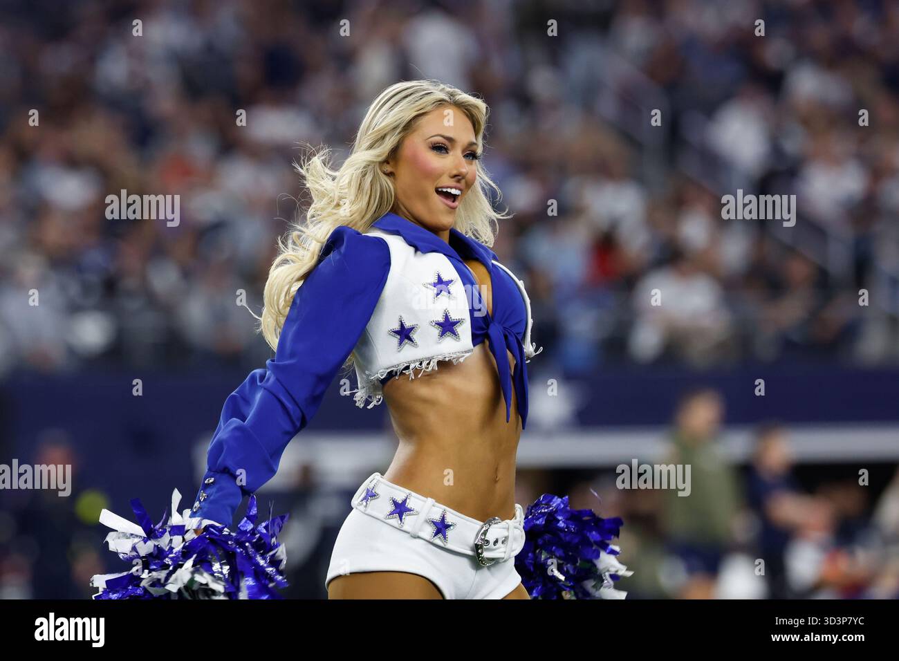 A Dallas Cowboys cheerleader performs during a NFL football game ...