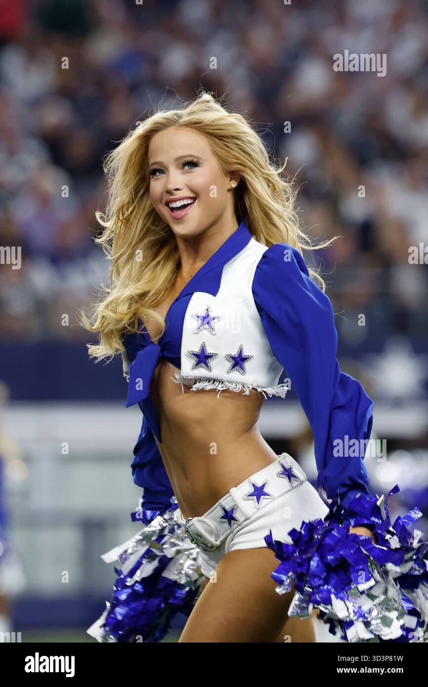A Dallas Cowboys cheerleader performs during a NFL football game ...
