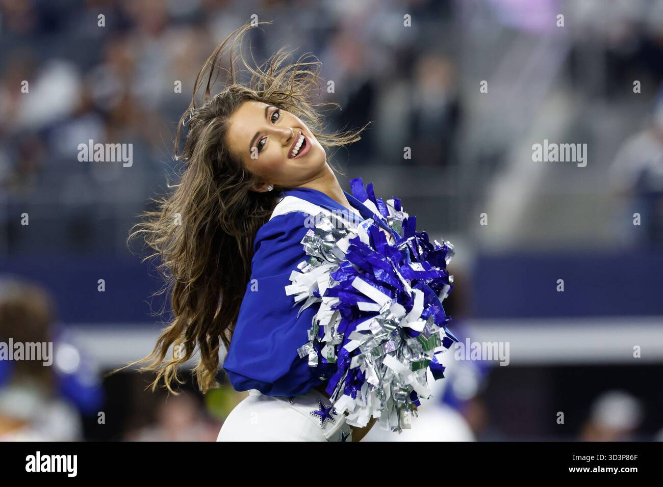A Dallas Cowboys cheerleader performs during a NFL football game ...