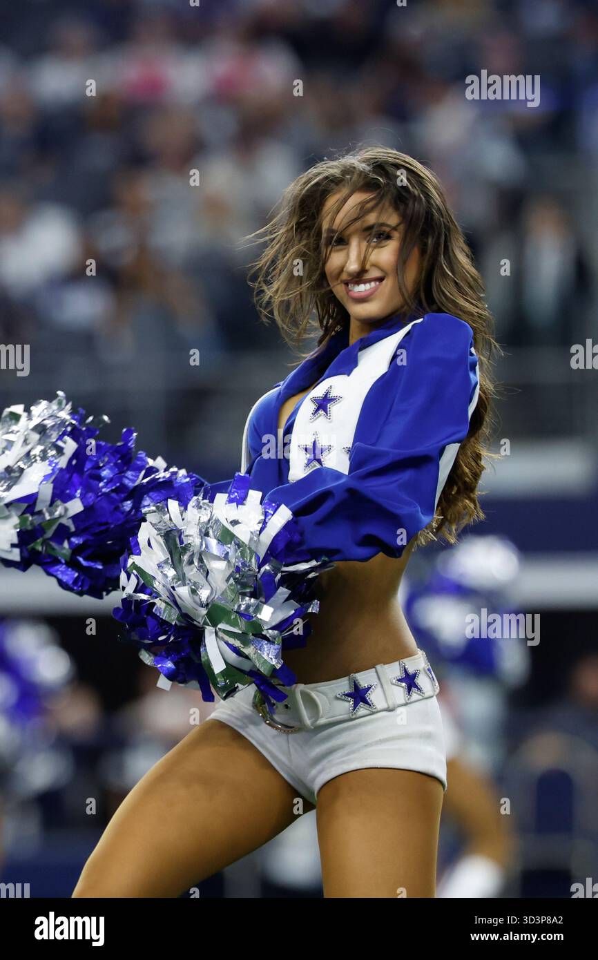 A Dallas Cowboys cheerleader performs during a NFL football game ...