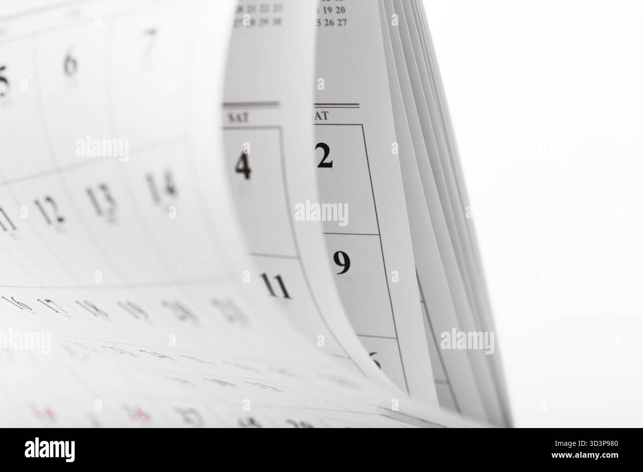 Flipping through a calendar displaying numbered dates and days of the ...