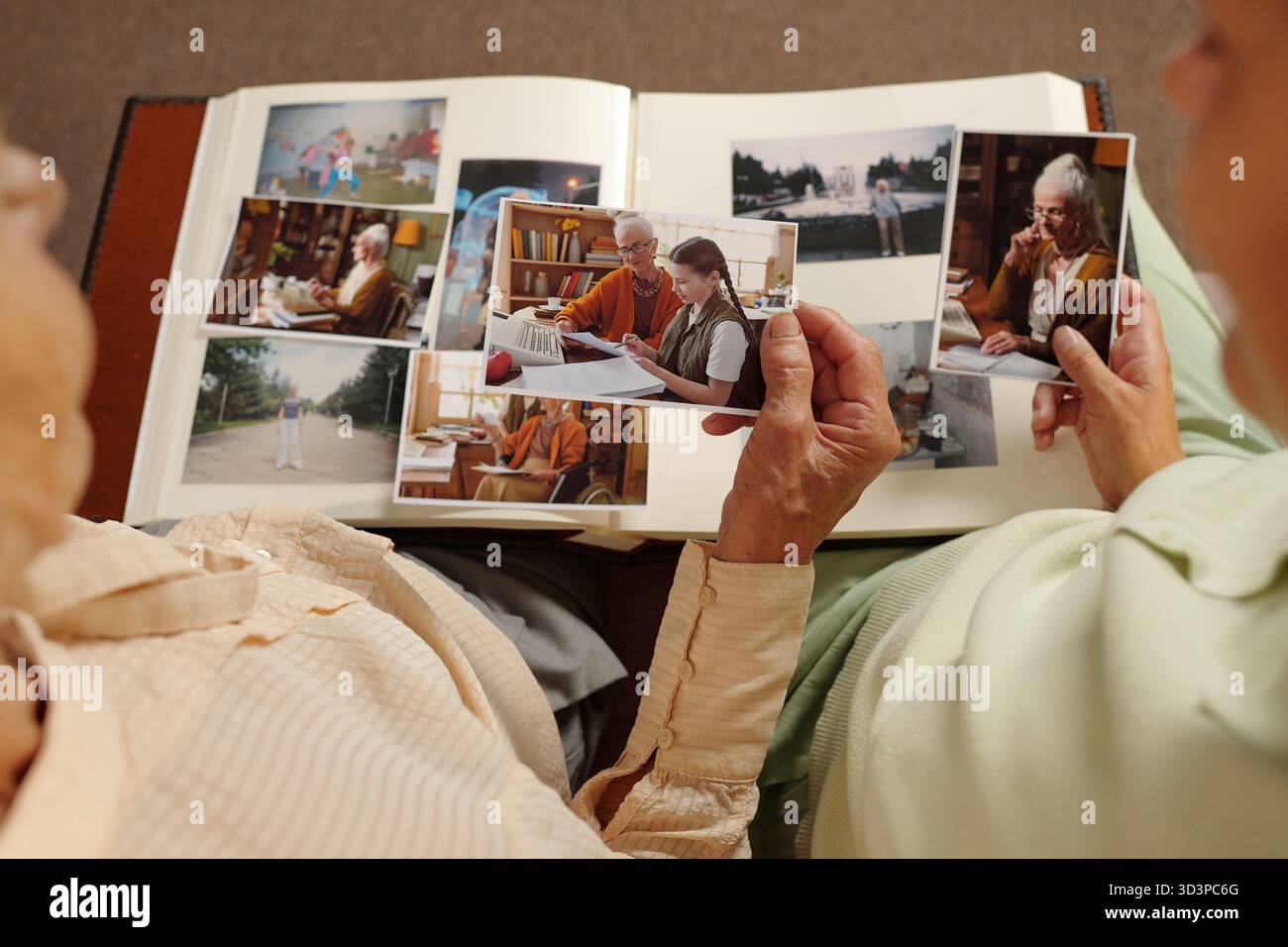 Senior Caucasian Women Reminiscing While Looking through Family Photo ...