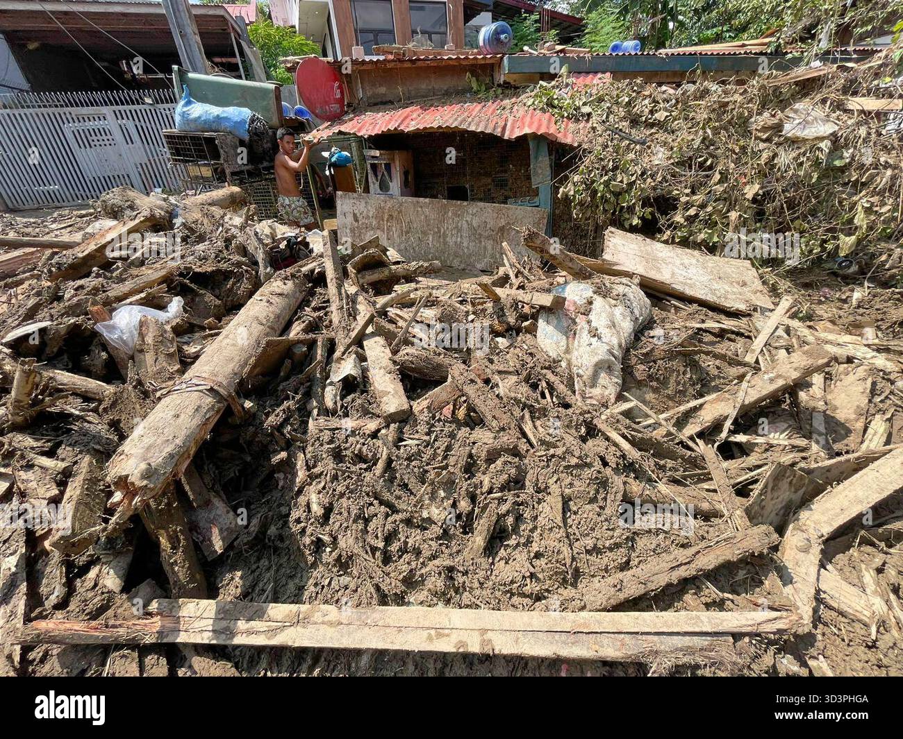 Debris lays outside a house as residents return to their flood damaged ...