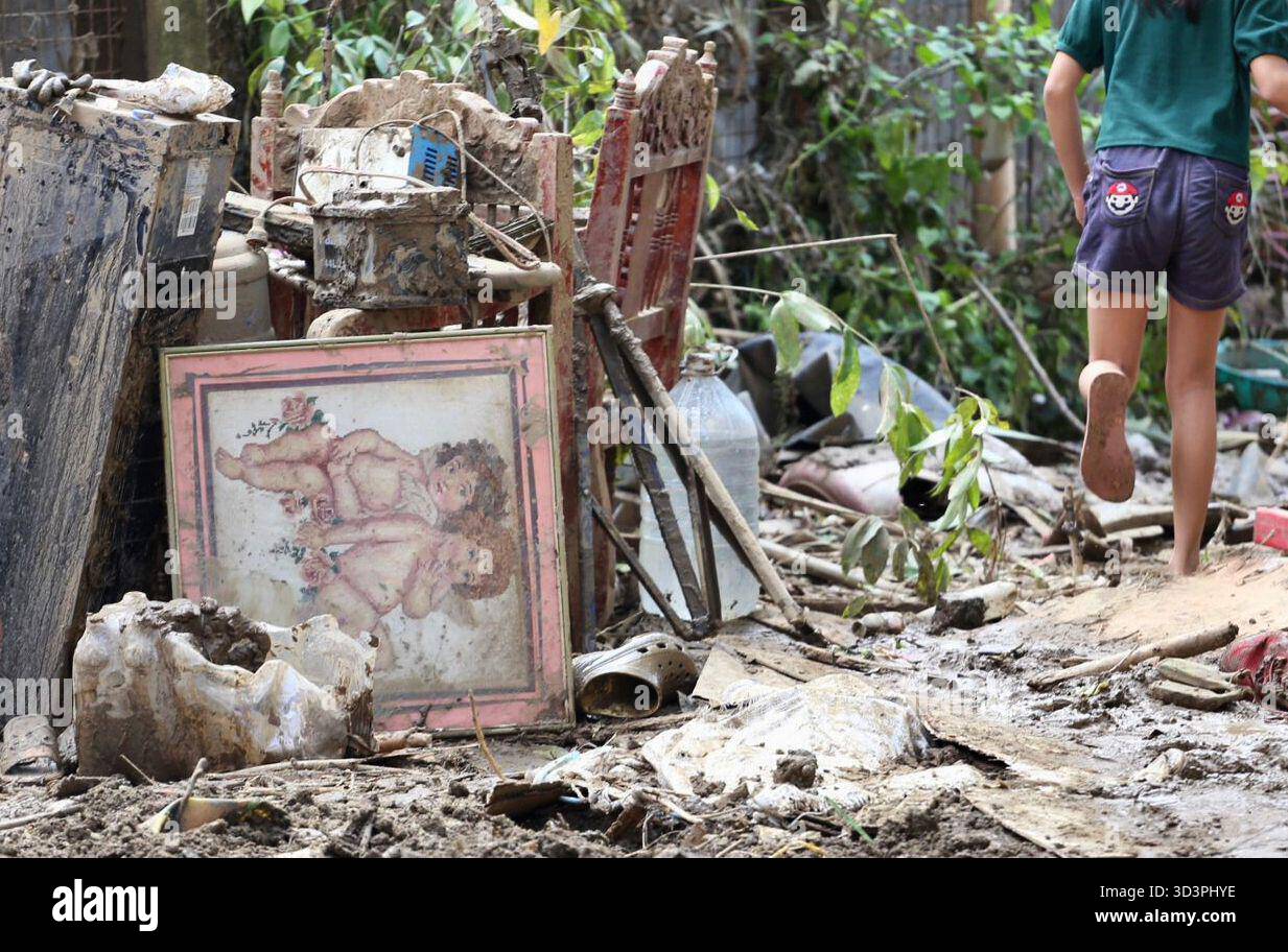 Debris and items outside as residents return to their damaged homes in ...