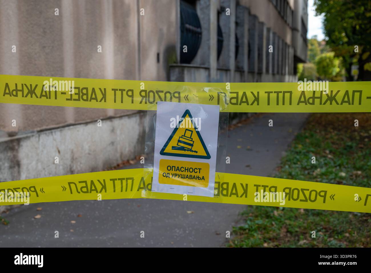 A sign on a taped off area of a building in Belgrade stating danger of ...