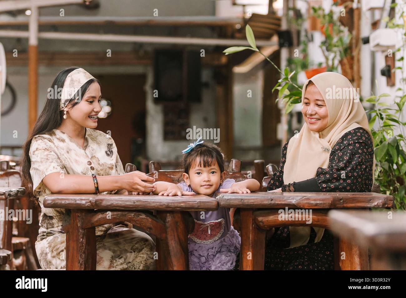 A heartwarming scene of three generations of a Muslim family in ...