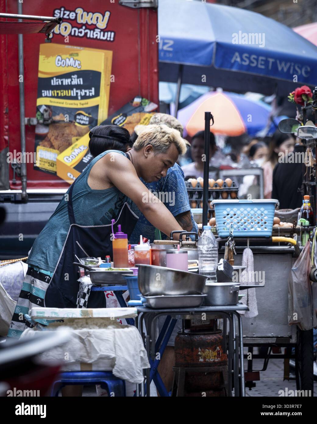Bangkok, Thailand - 28 May 2023: View of a street food vendor preparing ...