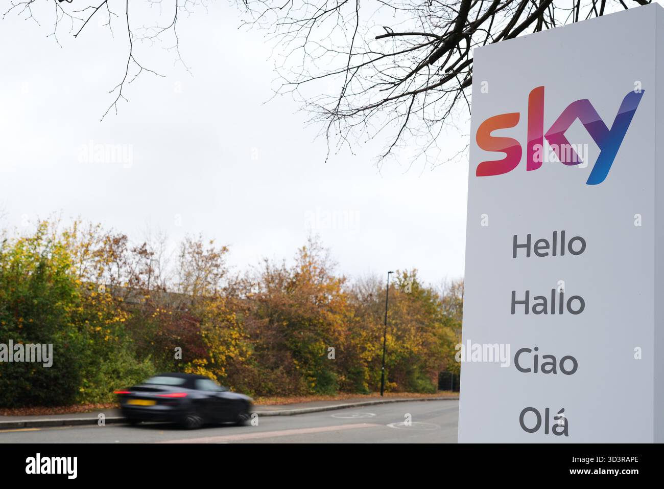 A car passes a sign of the Sky headquarters, British broadcaster and ...