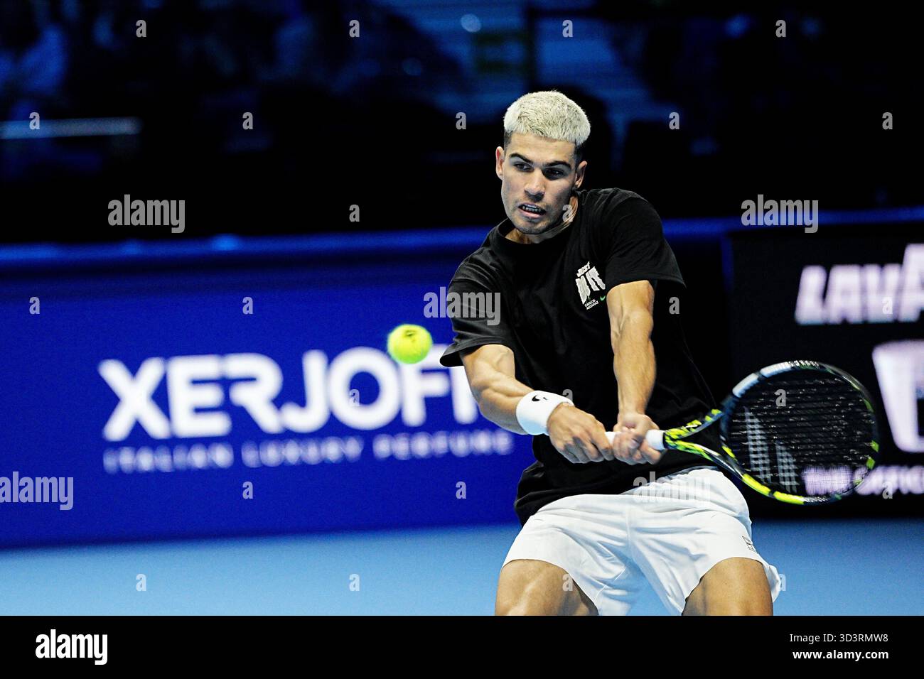 Carlos Alcaraz plays a backhand against Jannik Sinner as they practice ...