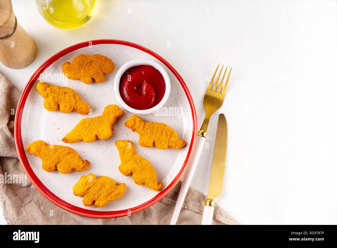 Tasty kids food, dinosaur shaped chicken nuggets. Plate with dino ...
