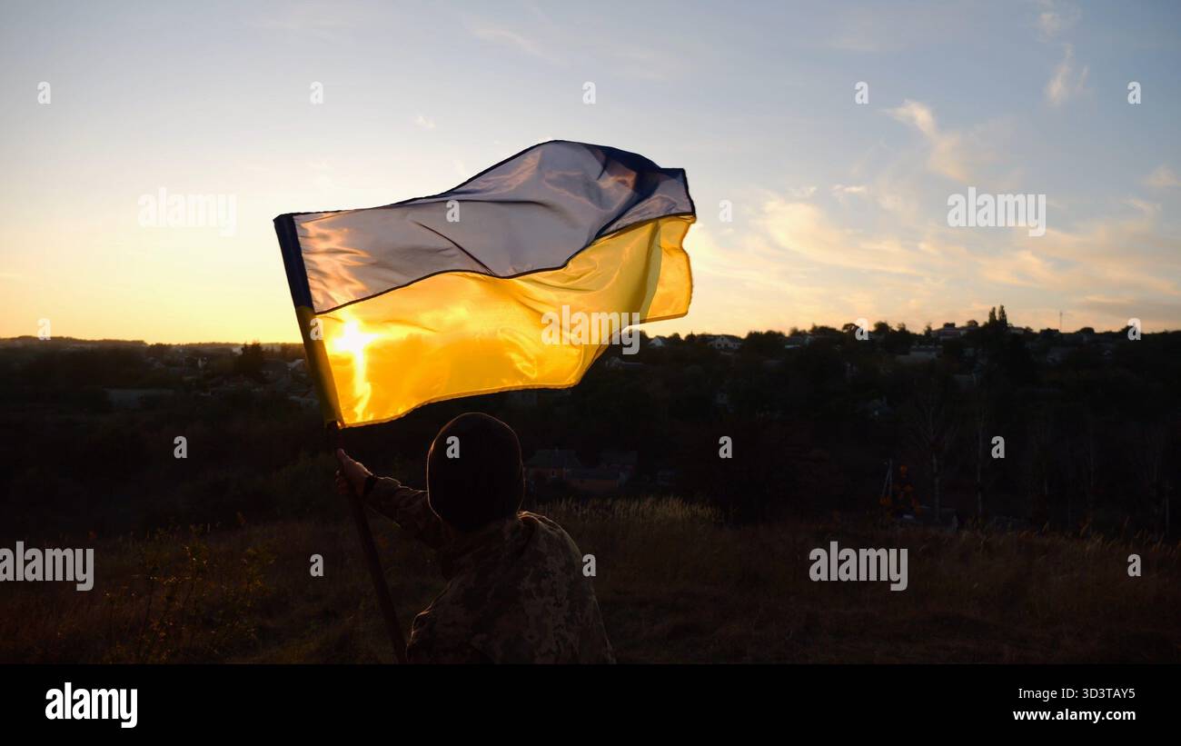 Male military lifted flag ukraine hi-res stock photography and images ...