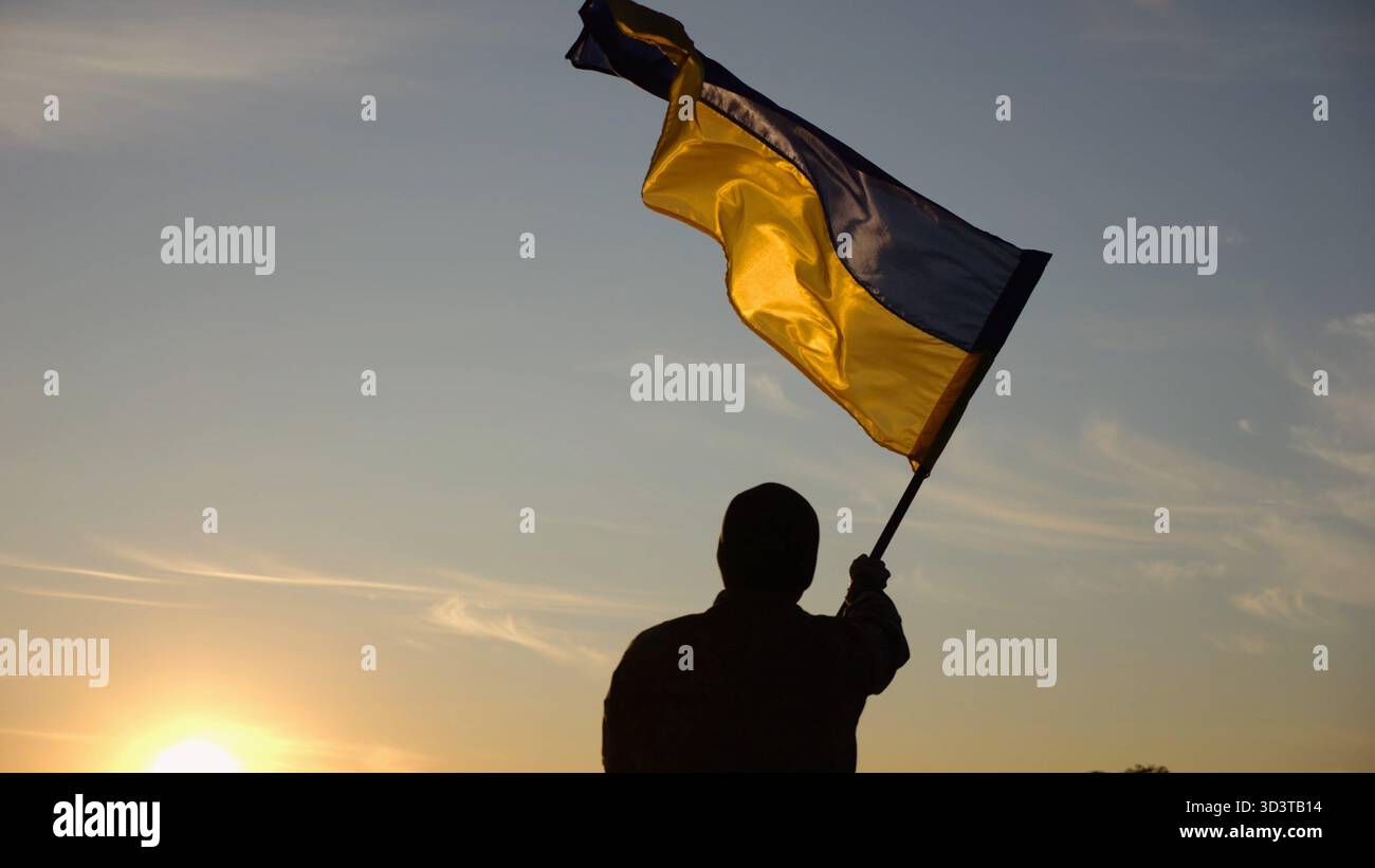 Male military lifted flag ukraine hi-res stock photography and images ...